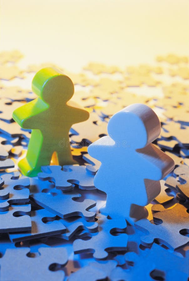 Figures on Puzzle Pieces stock image. Image of challenge - 20062785