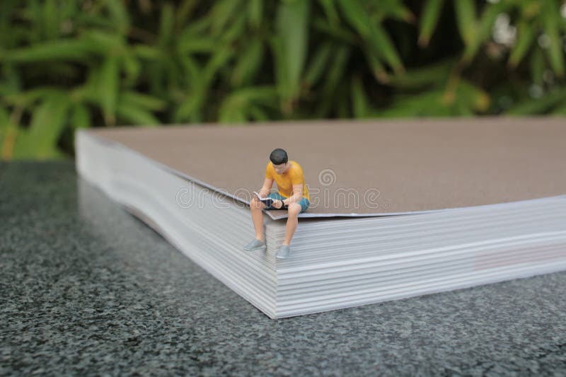 Figures Reading and Relaxing on a Giant Book Stock Image - Image of ...