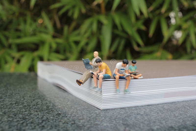 Figures Reading and Relaxing on a Giant Book Stock Image - Image of ...