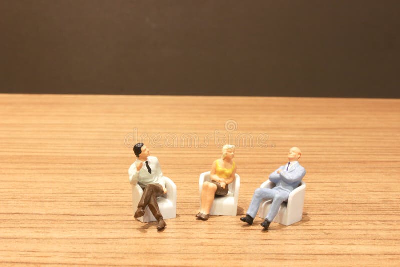 Figures are Sitting at the Table in the Office Stock Image - Image of ...