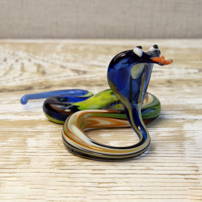 Figurine of Snake from Glass on Rough Wooden Background Stock Image ...