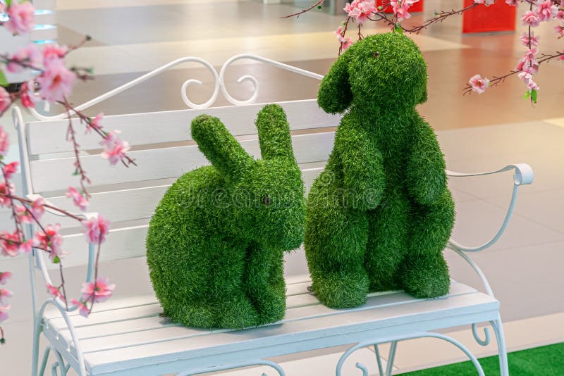 Figurines of Rabbits Made of Artificial Grass on a Bench Stock Image ...
