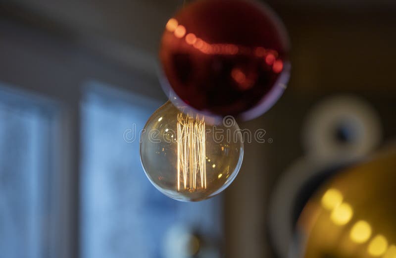 The filament in the lamp. stock image. Image of black - 113967027