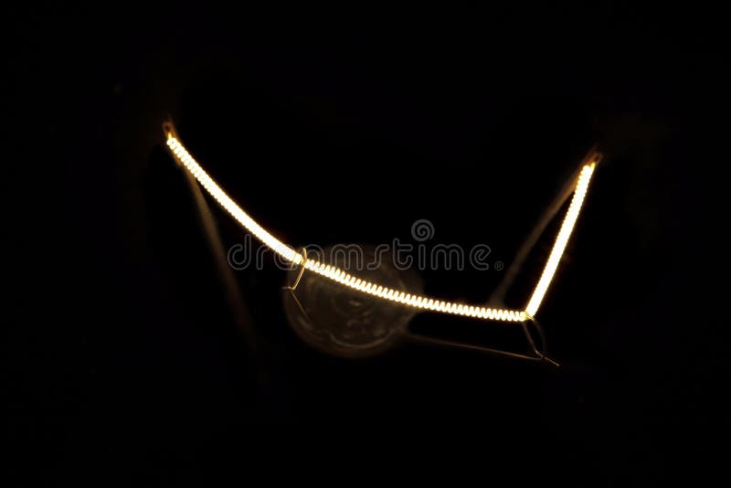 The filament in the lamp. stock photo. Image of energy - 113967020