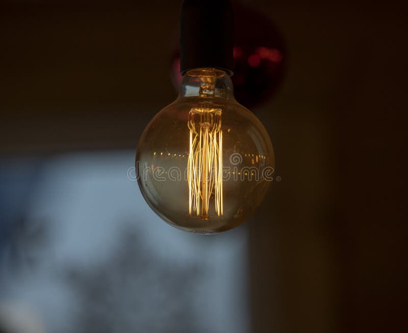 The filament in the lamp. stock image. Image of black - 113967027