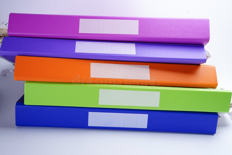 File Folder Binder Stack of Multi Color on Table. Stock Photo - Image ...