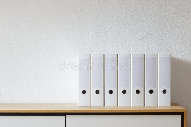 File Folder on Modern Sideboard in Bright Room Stock Photo - Image of ...