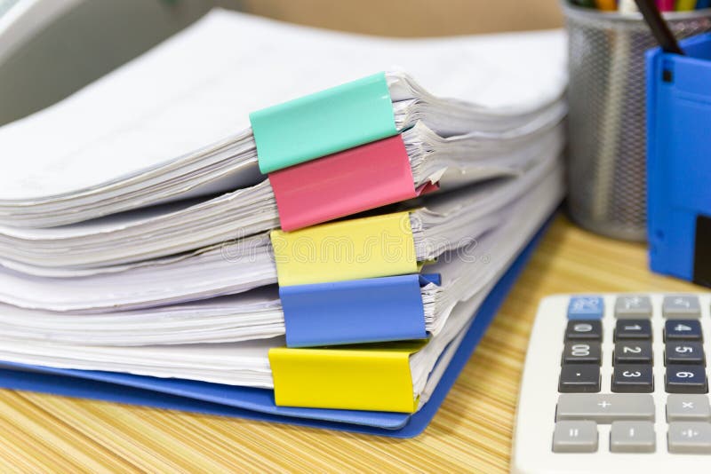 File Folder and Stack of Business Report Paper File on the Table in a ...