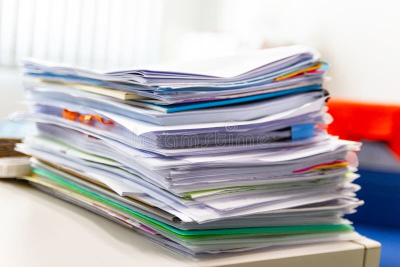 File Folder and Stack of Business Report Paper File on the Table Stock ...