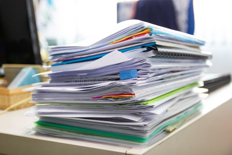 File Folder and Stack of Business Report Paper File on the Table Stock ...