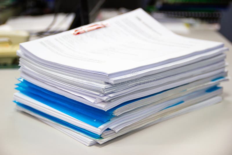 File Folder and Stack of Business Report Paper File on the Table in a ...