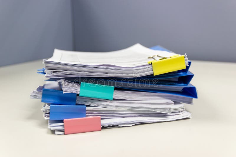 File Folder and Stack of Business Report Paper File on the Table in a ...