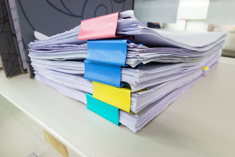 File Folder and Stack of Business Report Paper File on the Table in a ...