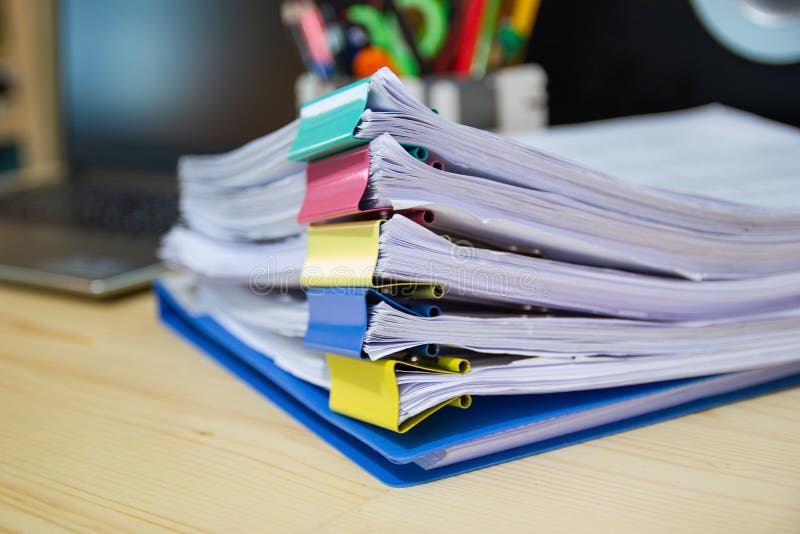 File Folder and Stack of Business Report Paper File on the Table in a ...