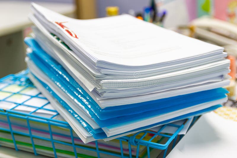 File Folder and Stack of Business Report Paper File on the Table in a ...