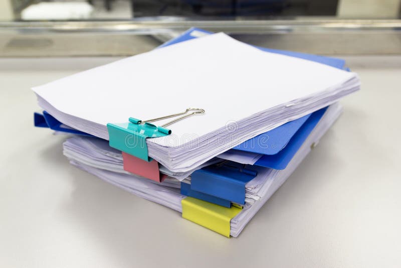 File Folder and Stack of Business Report Paper File on the Table in a ...