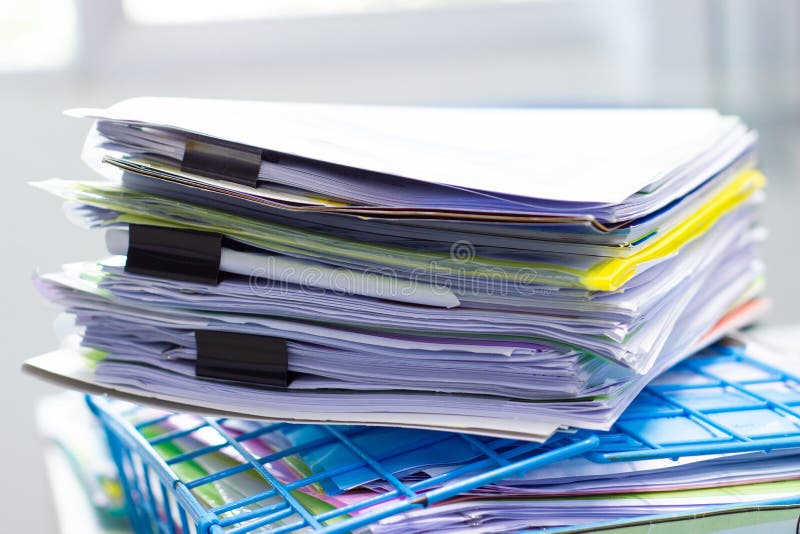 File Folder and Stack of Business Report Paper File on the Table Stock ...