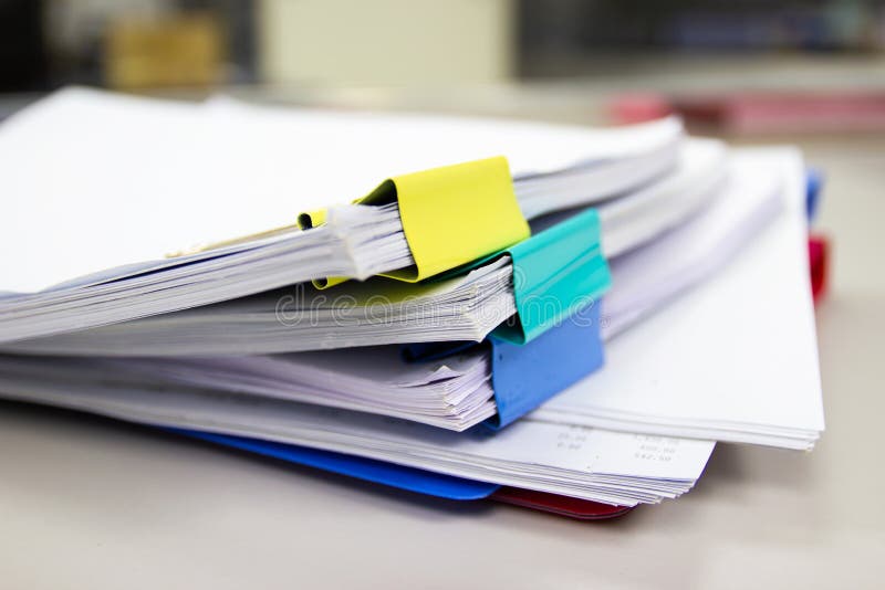File Folder and Stack of Business Report Paper File on the Table Stock ...