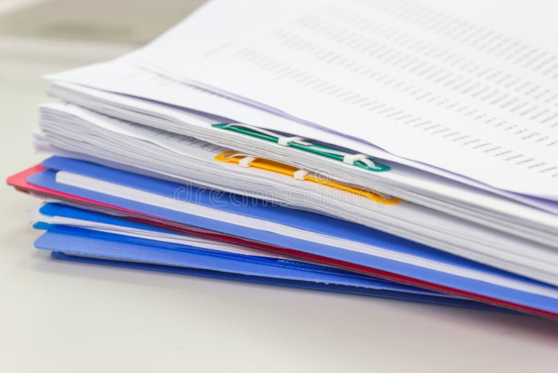 File Folder and Stack of Business Report Paper File on the Table Stock ...