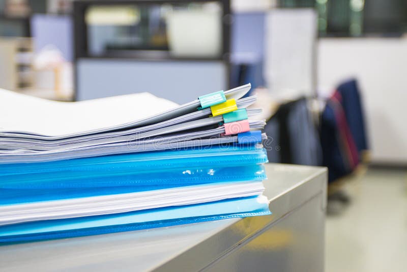 File Folder and Stack of Business Report Paper File on the Table Stock ...