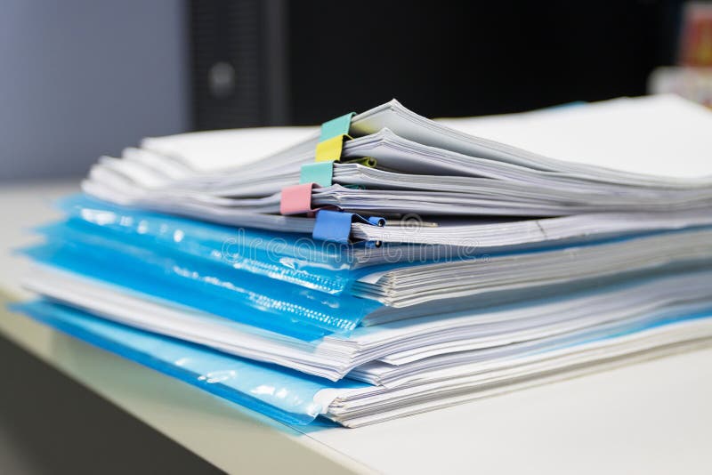 File Folder and Stack of Business Report Paper File on the Table Stock ...