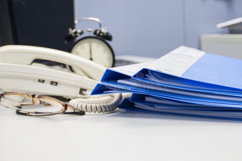 File Folder and Stack of Business Report Paper File on the Table Stock ...