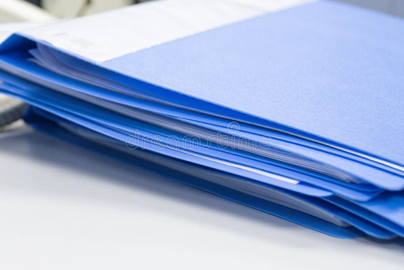 File Folder and Stack of Business Report Paper File on the Table Stock ...