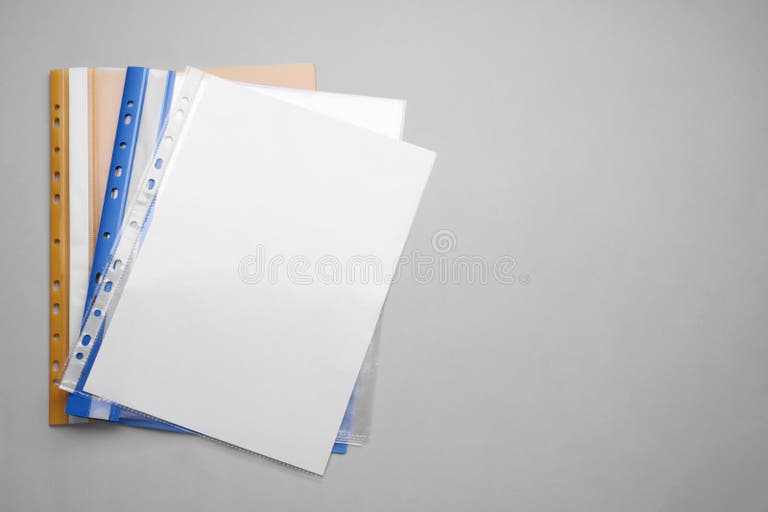 File Folders with Punched Pockets and Paper Sheets on Light Grey ...
