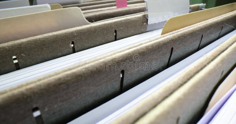 Neatly Arranged Folders Labeled with Years Stand on Bookshelf Stock ...