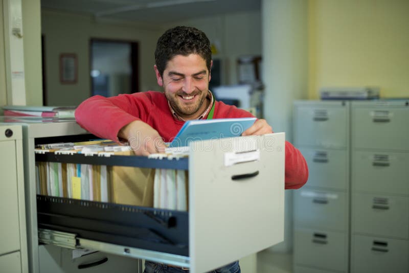 Files clerk at office stock photo. Image of order, hipster - 53798476