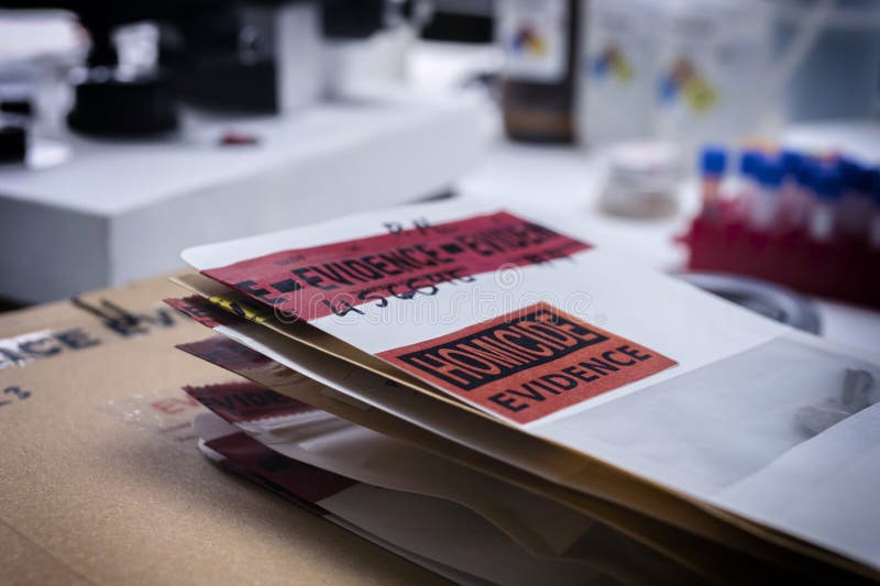 Files and Evidence Bag in a Crime Lab Stock Photo - Image of ...