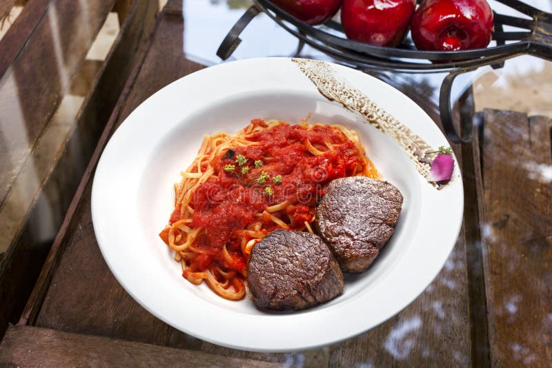 Filet mignon with pasta stock image. Image of plate - 180864163