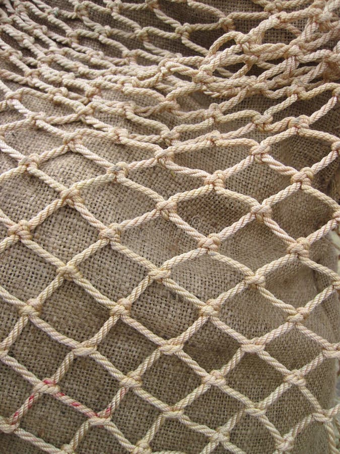 Filet Sur Le Tissu De Toile Photo stock - Image du fibre, brun: 38383996