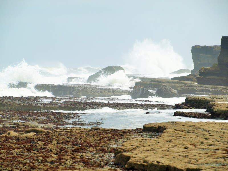 Filey Brig Waves Crashing Onto the Rocks. Stock Photo - Image of ...