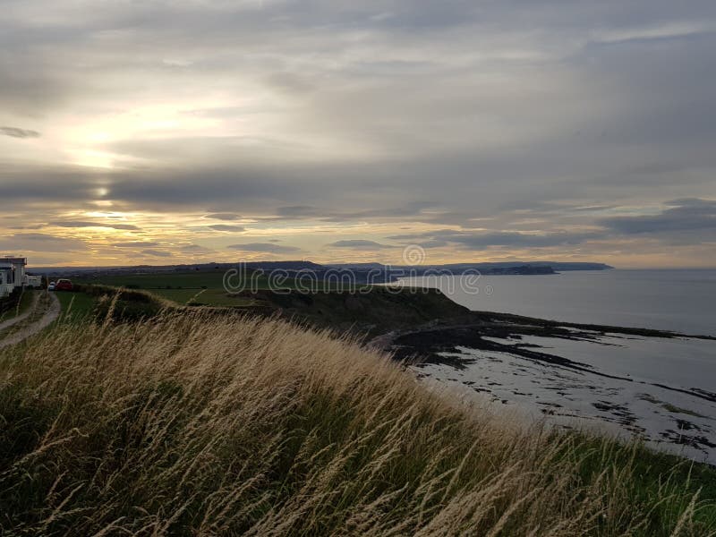 Filey stock image. Image of haven, cliffs, long, grasses - 129691955
