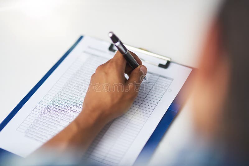 Filing Out a Survey. Shot of a Person Filling in a Form. Stock Image ...