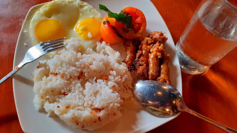 Filipino Silog Breakfast with Garlic Fried Rice, Longsilog, and Two ...