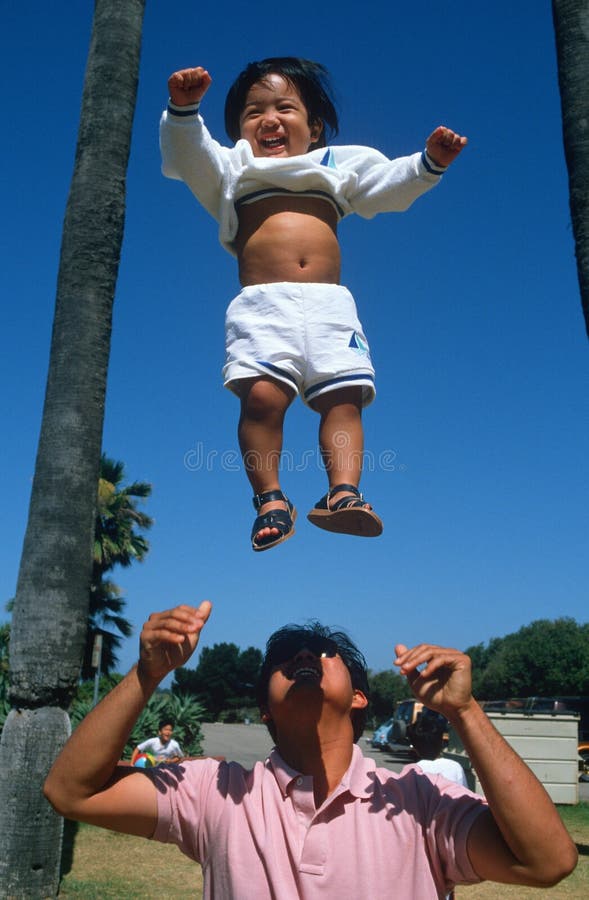 Filipino Father Tossing Baby in the Air Editorial Photo - Image of ...