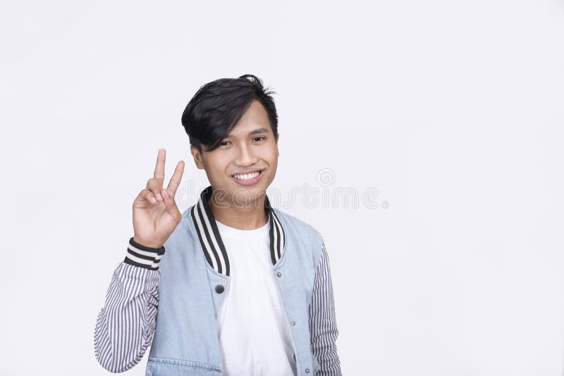 A Filipino Guy Makes a Peace Sign. Isolated on White Background Stock ...