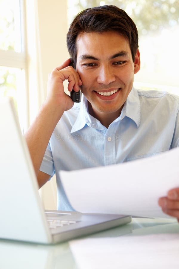 Filipino Man Working at Home Stock Image - Image of papers, lifestyle ...