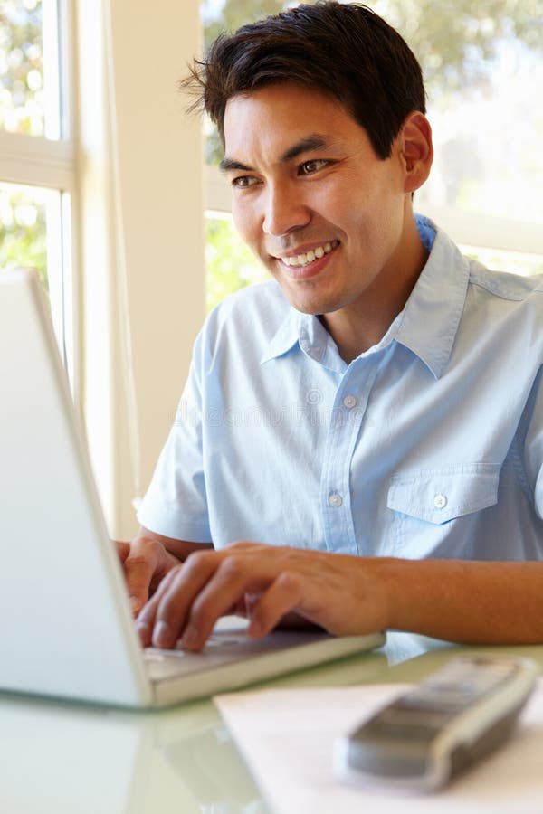 Filipino Man Working on Laptop Stock Photo - Image of indoors ...