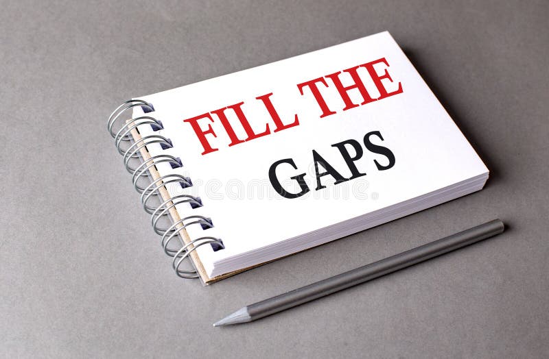 FILL the GAPS Word on Notebook on Grey Background Stock Image - Image ...
