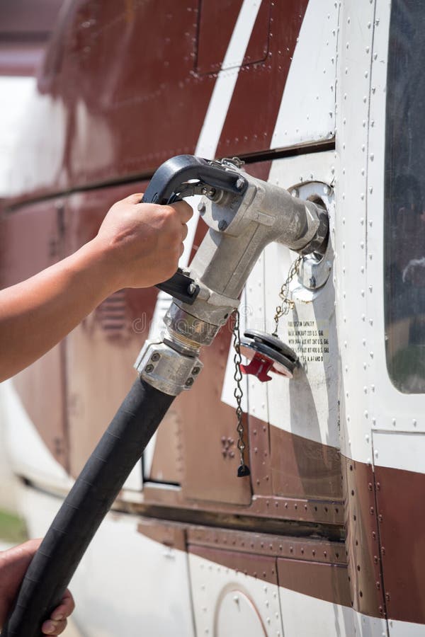 Fill the gas to helicopter stock image. Image of aircraft - 63648009