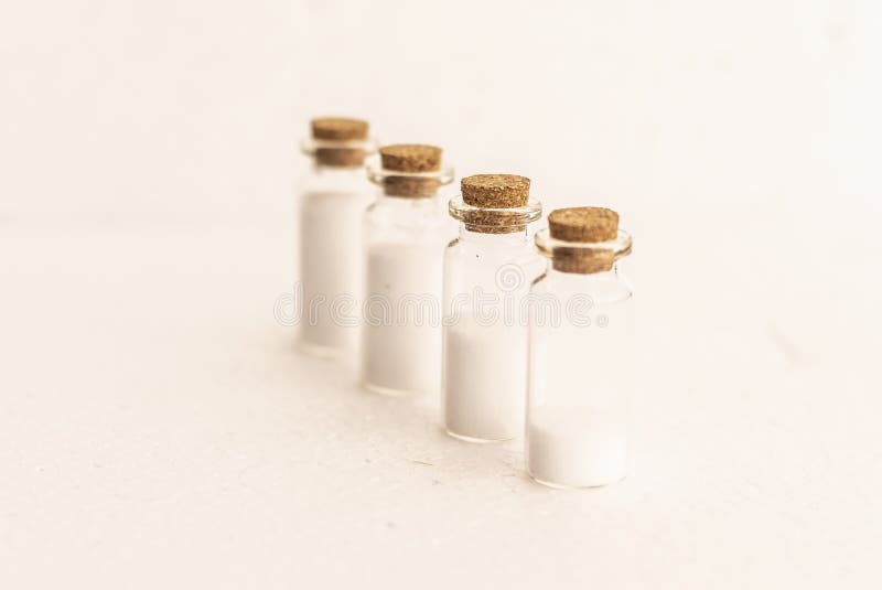 Four Little Bottles Filled with White Powder Stock Image - Image of ...