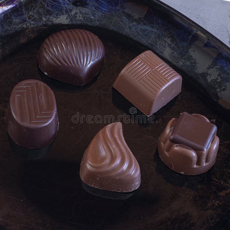Filled Chocolate Candies Various Assorted Flavors Black Plate Stock ...