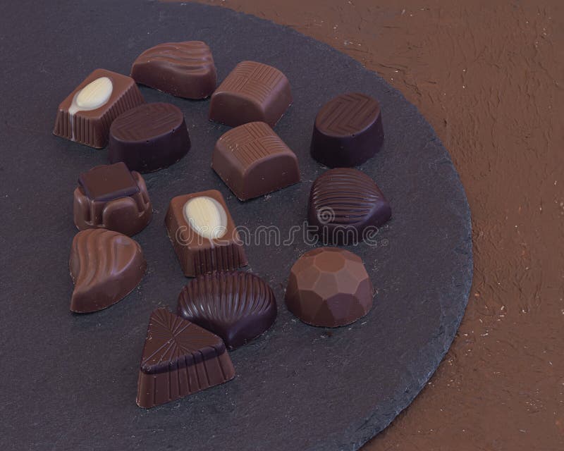 Filled Chocolate Candies Various Assorted Flavors on Stone Plate Stock ...