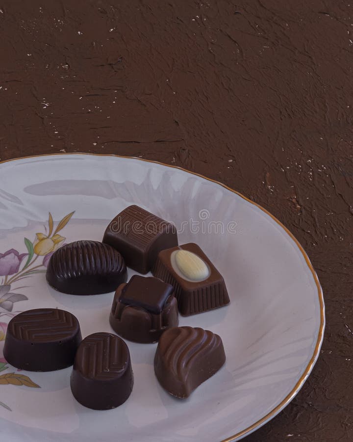 Filled Chocolate Candies Various Assorted Flavors on White Plate Stock ...