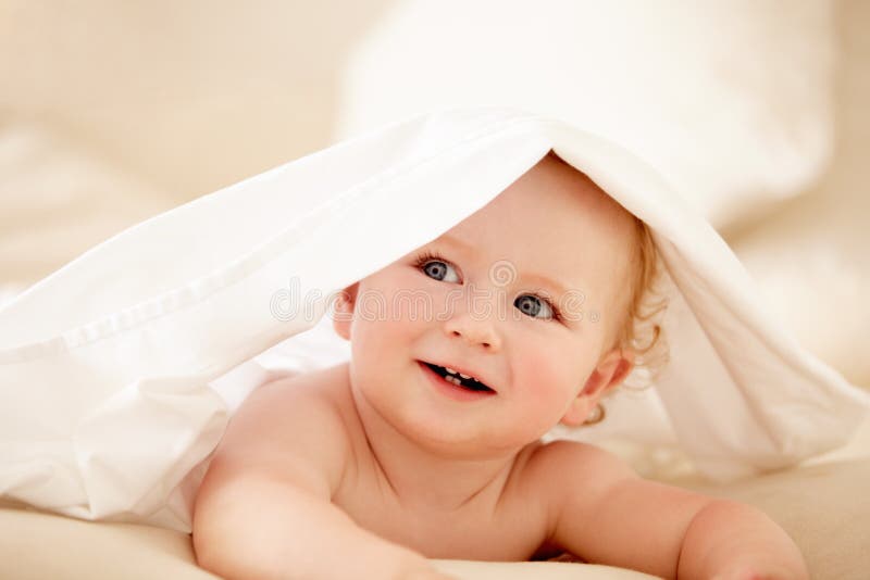 Filled Curiousity. Cute Baby Boy Lying Under a Sheet Playfully and ...