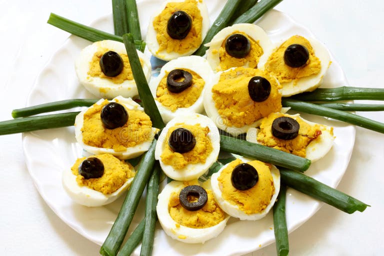 Filled Eggs with Olives on Top Stock Photo - Image of focus, background ...
