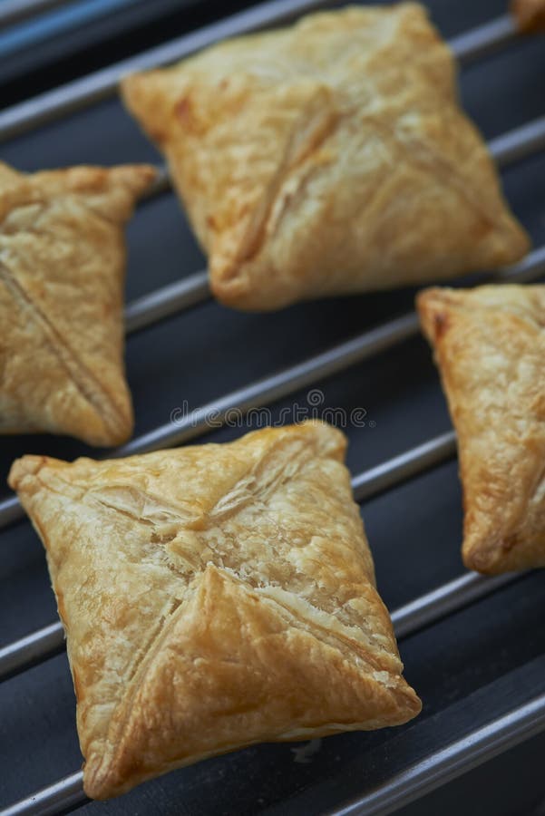 Filled Pastry Pockets on Cooling Rack Stock Photo - Image of pockets ...